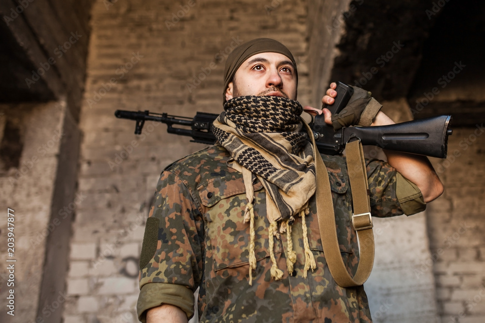 The Arab soldier with the AK-47 Kalashnikov assault rifle Stock Photo ...