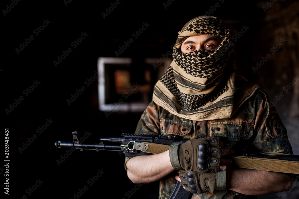 The Arab soldier with the AK-47 Kalashnikov assault rifle Stock Photo ...