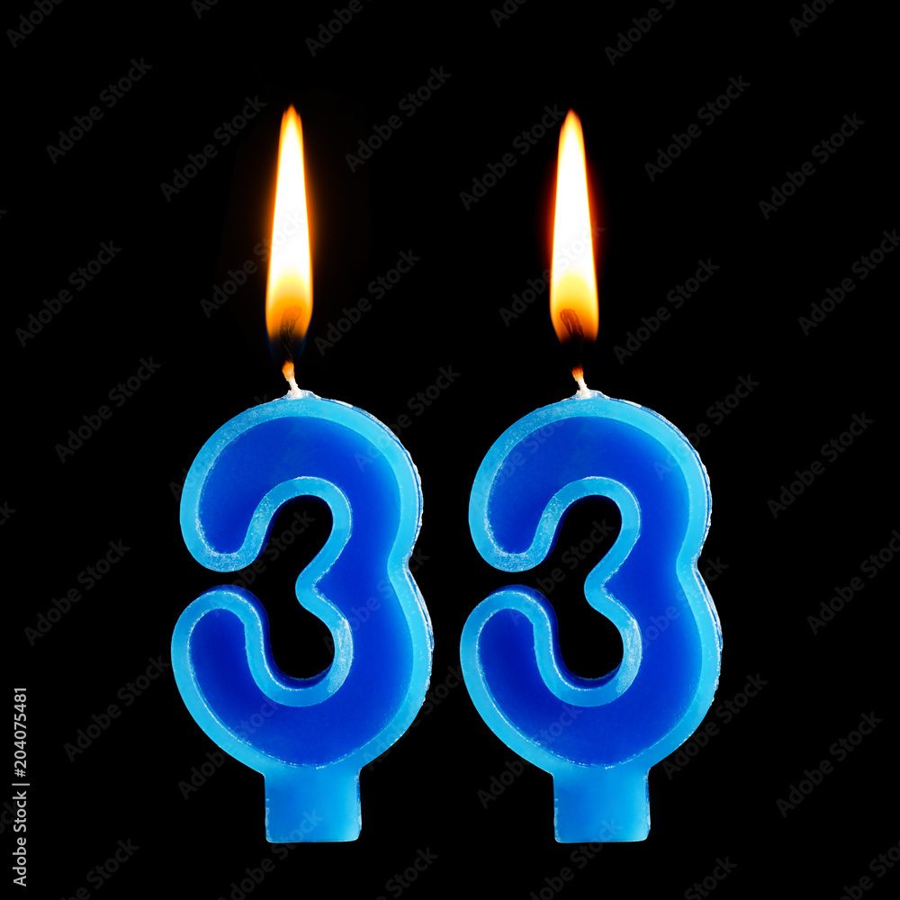 Burning birthday candles in the form of 33 thirty three for cake ...