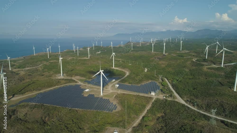 Aerial view of Windmills for electric power production on the seashore ...