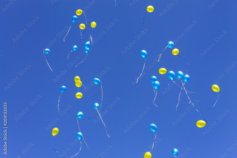 Blue and yellow balloons fly in the sky, background Stock Photo | Adobe ...