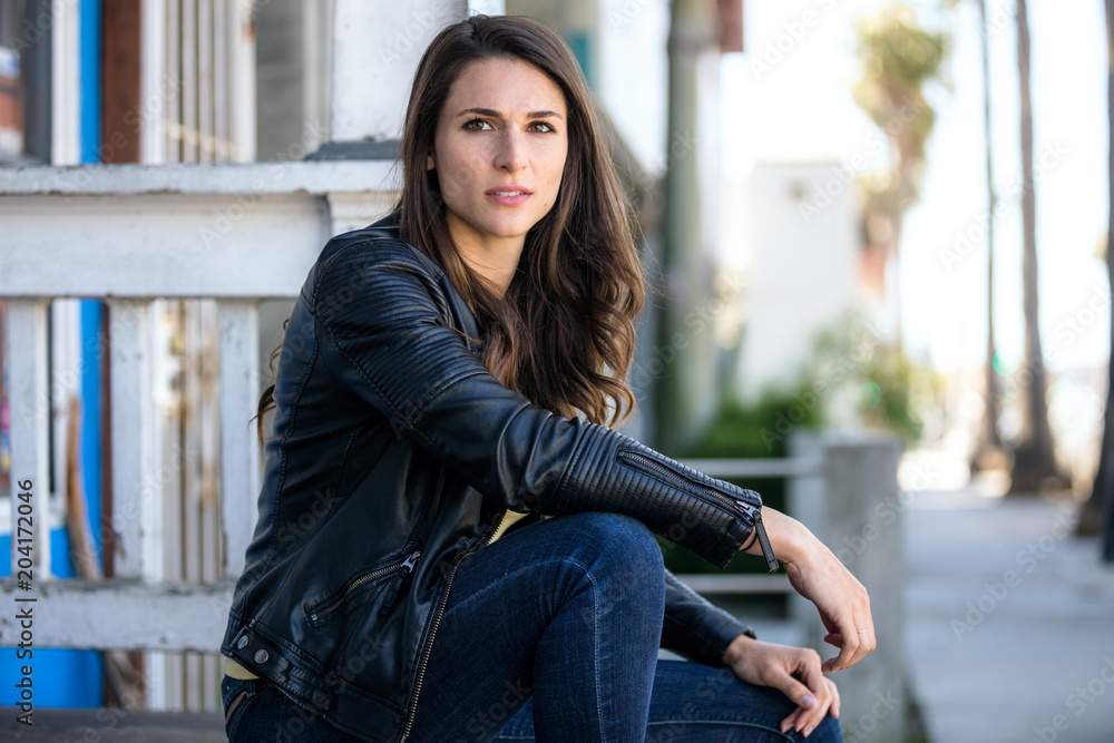 Beautiful rebel rough serious woman looking strong and confident on ...