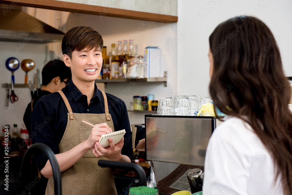 Asian man staff taking order from the customer in coffee shop Stock ...