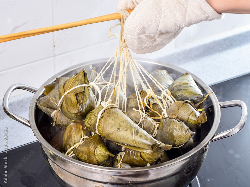 Procedure step of making zongzi or rice dumpling recipe, steam and boil ...
