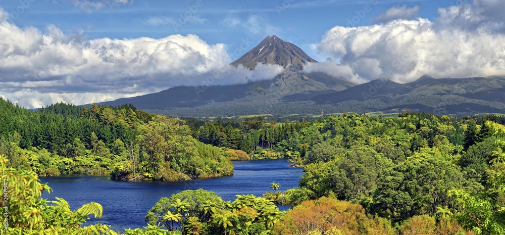 Jungle forest with lake Lake Mangammahoe and volcano Mount Taranaki ...