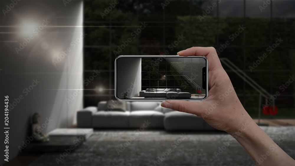 Hand holding smart phone, AR application, simulate furniture and ...