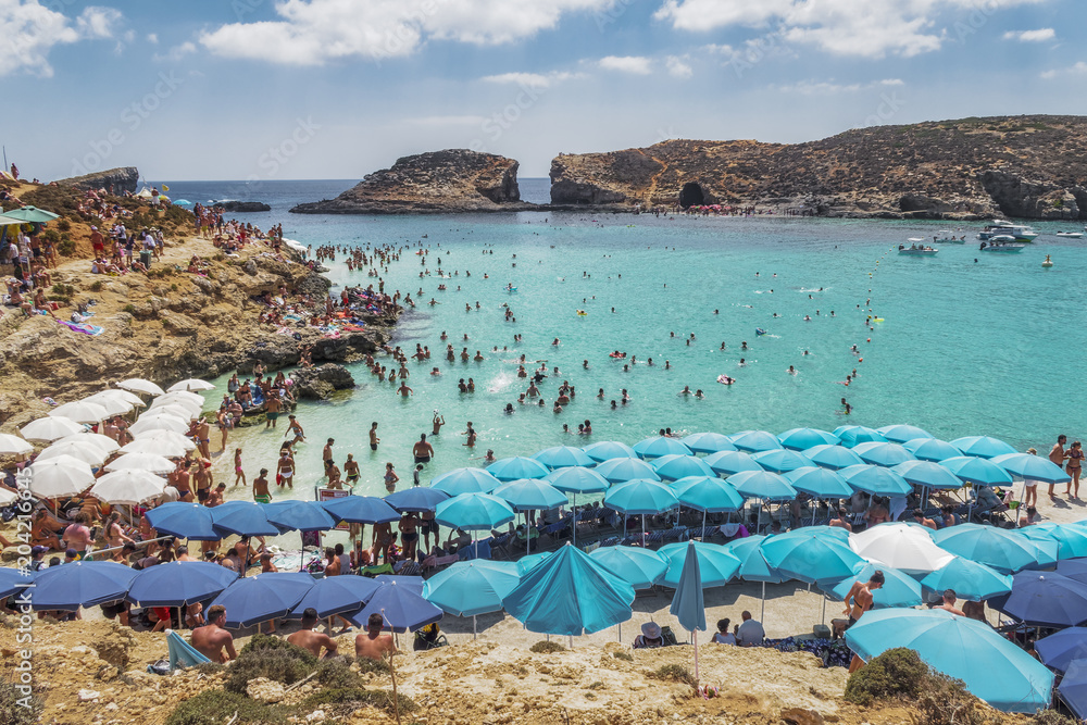 Comino Island, Malta Blue Lagoon panoramic landscape with bathers and ...