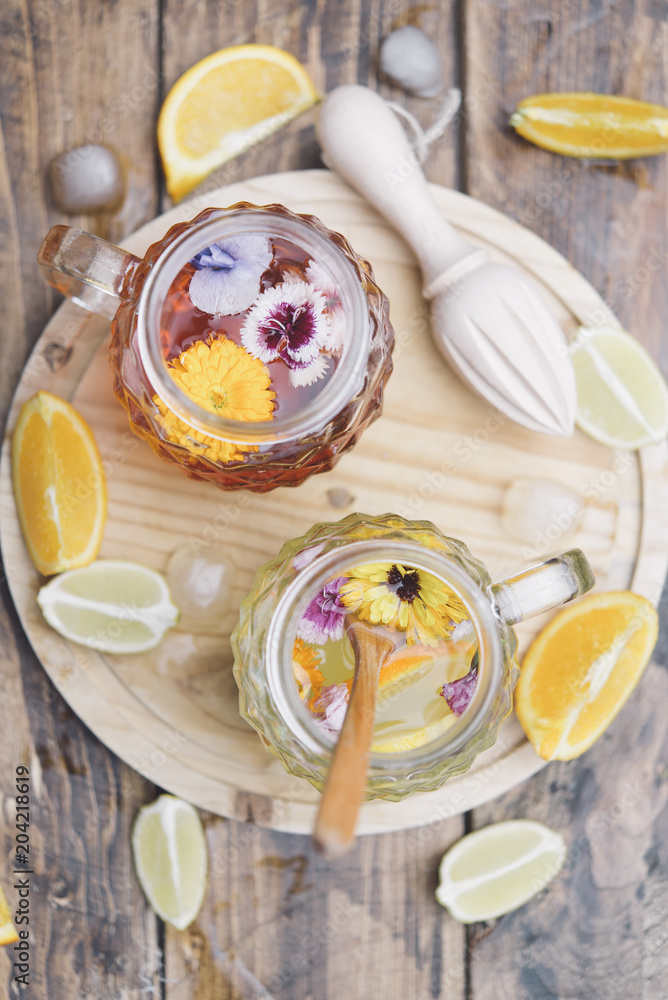 Refreshing mineral water with edible flowers, Viola wittrockiana ...