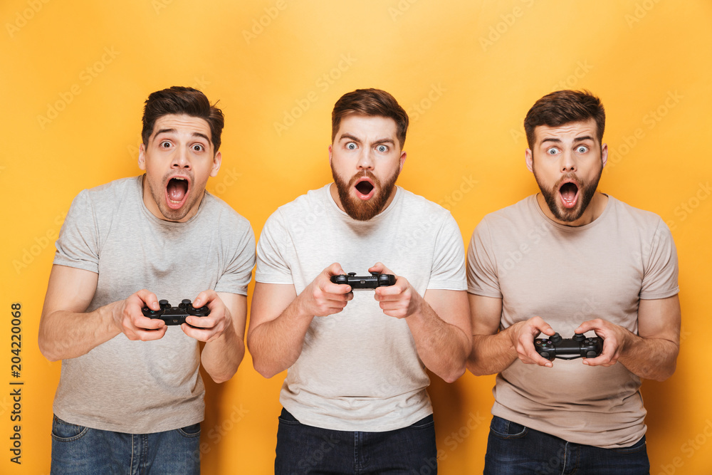 Three young shocked men Stock-Foto | Adobe Stock