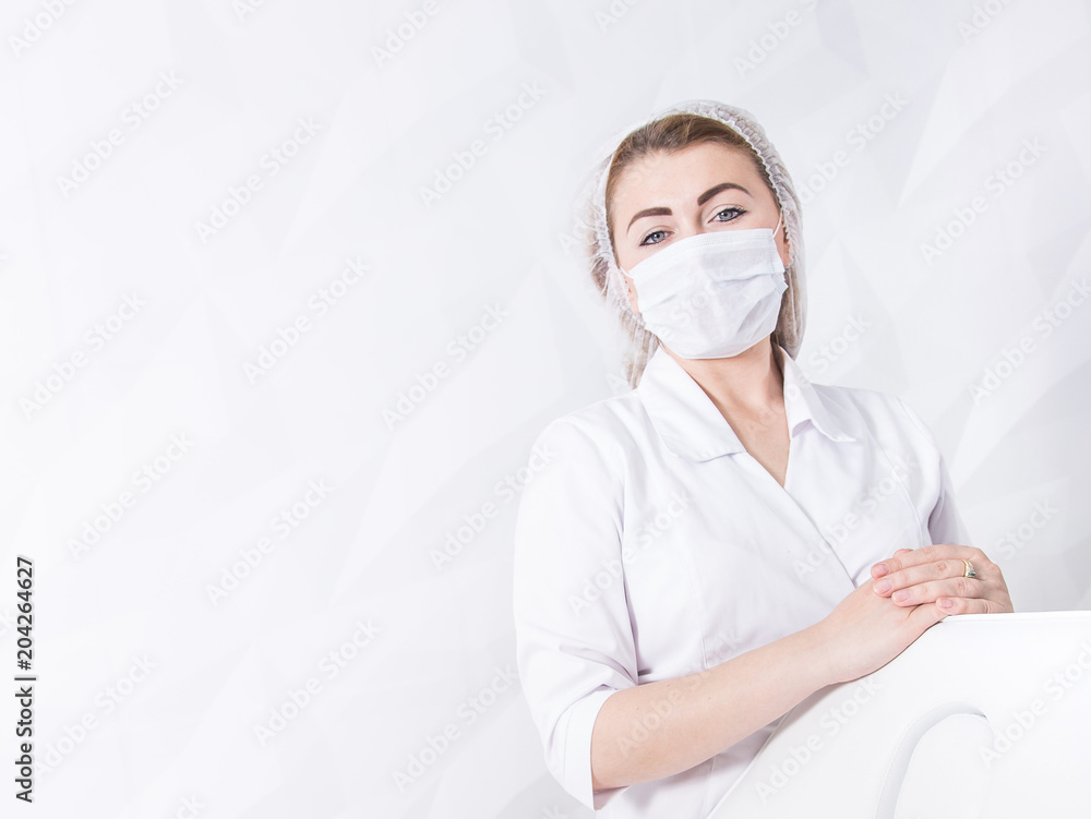 Portrait of a female medical doctor beautician in white lab coat and in ...