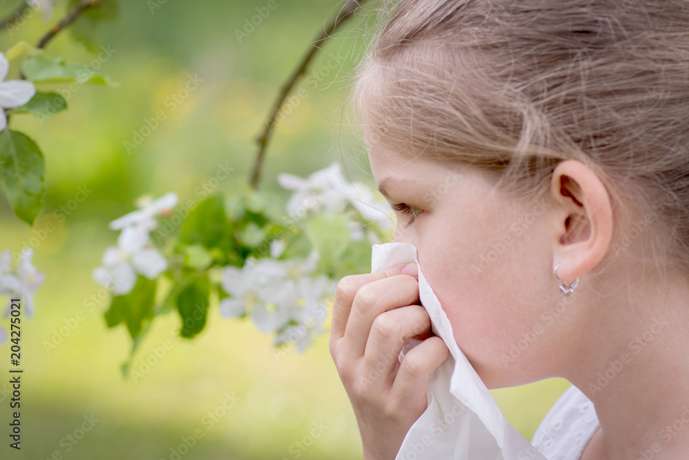Little girl sneezing due to allergic reaction outdoor Stock Photo ...