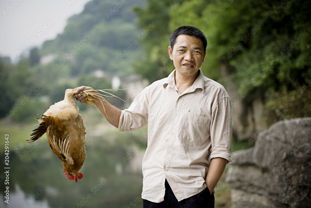 People Holding Chickens