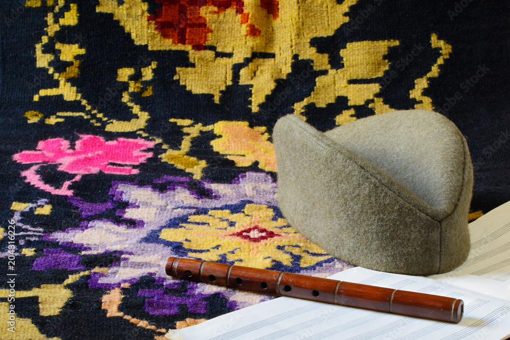 Sajkaca, a Serbian folk hat, a hand-carved frula (a shepherd’s pipe ...