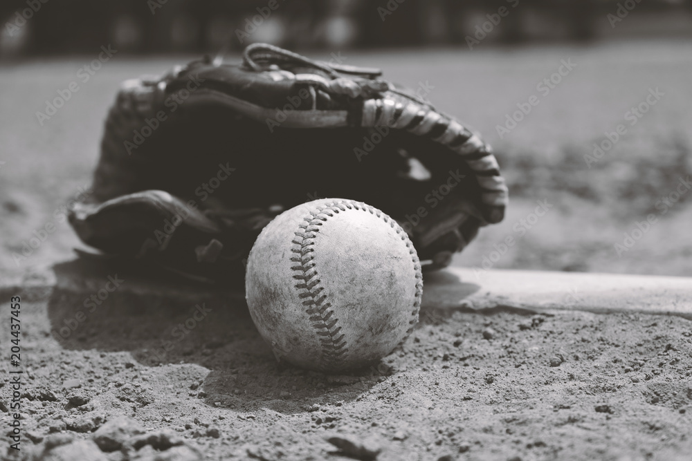Old dirty baseball with glove on dirt field brings back nostalgia of ...