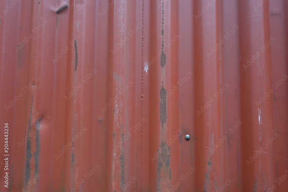 Corrugated metal sheet serves as a fence, view horizontal to vertical ...