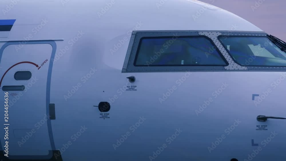 Pilot waves his hand from the cockpit of the aircraft preparing for ...