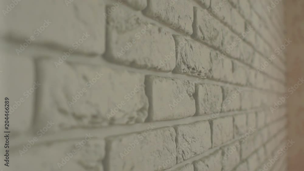 Decorative white brick wall close-up, the front background is blurred ...