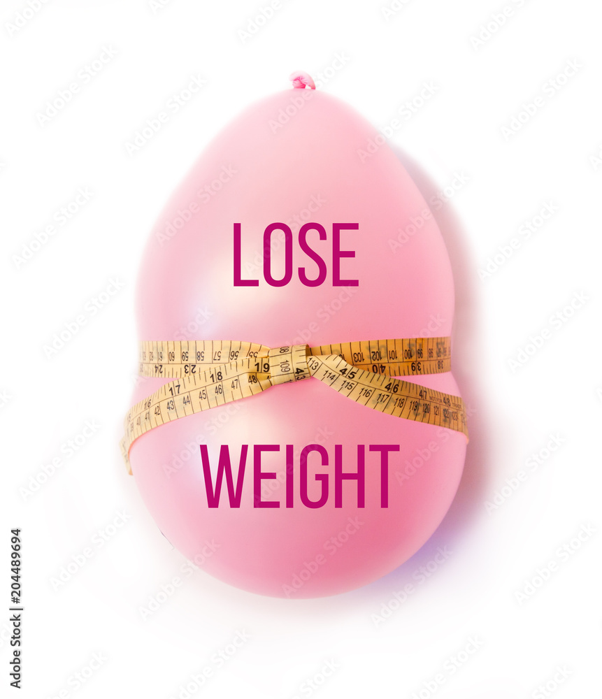 Balloon tied measuring tape on white background. Weight loss, slim body ...
