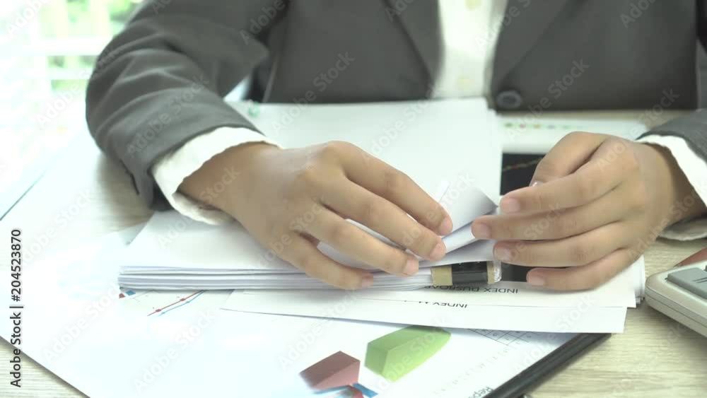 Business Documents concept : Businessman hands working in Stacks paper ...
