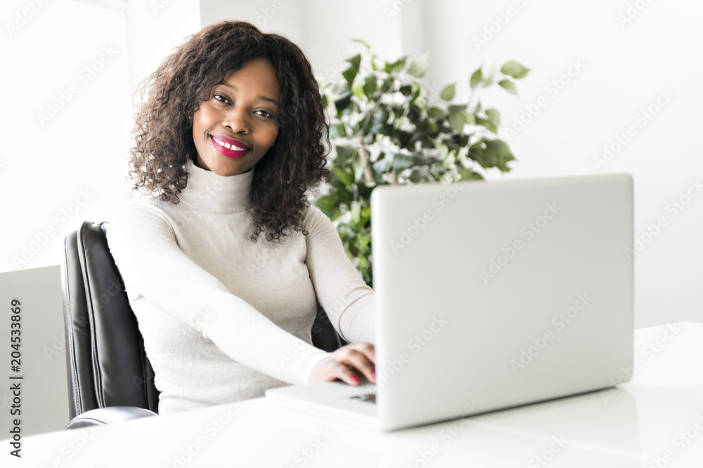 Beautiful black woman working on self employee office Stock Photo ...