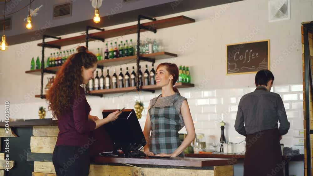 Video Stock Young people are buying coffee-to-go in nice local cafe and ...