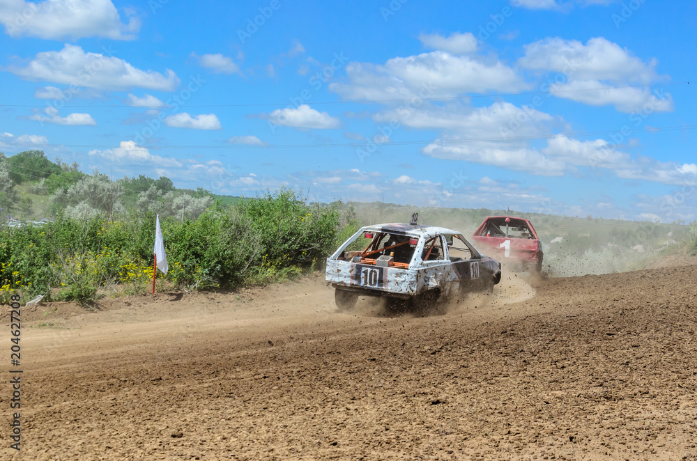 Race of the old wrecked cars. Rally on the open air with dust Stock ...