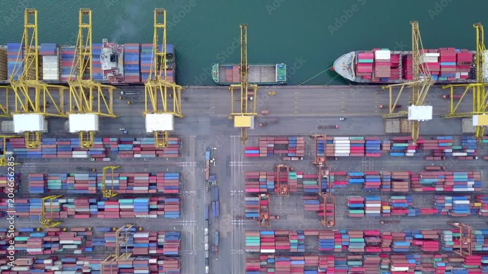 4k, Aerial top view of container ship, cargo ship anchored in the port ...