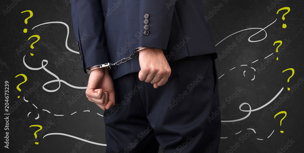 Now arrested men with handcuffs and chalk drawn question signs and ...