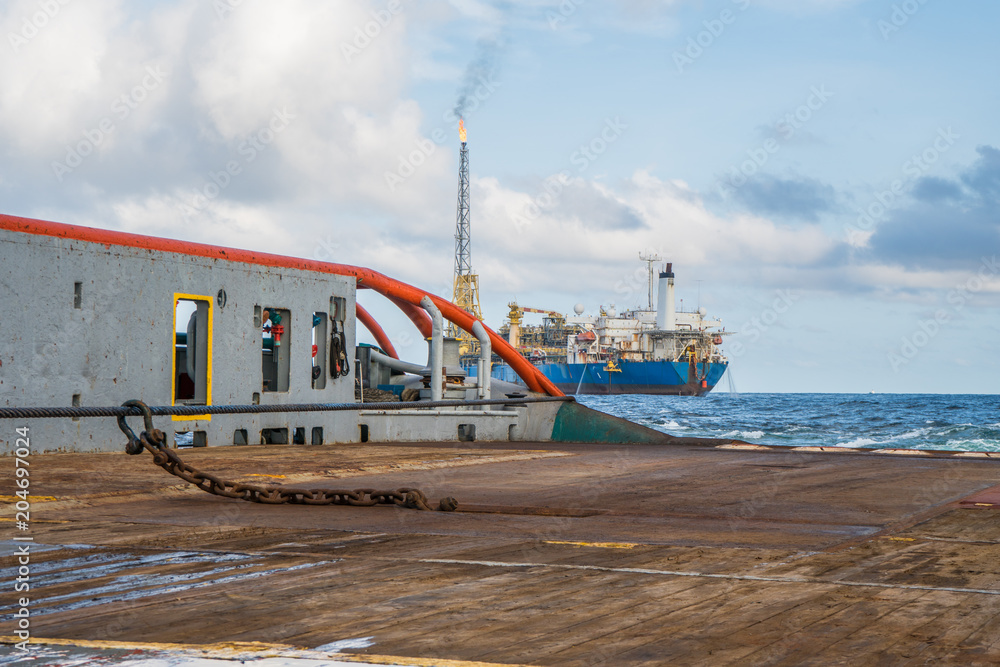 Anchor-handling Tug Supply AHTS vessel during dynamic positioning ...