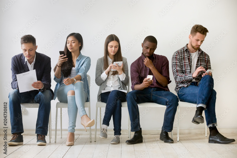 Diverse millennial unemployed people waiting in queue preparing for job ...