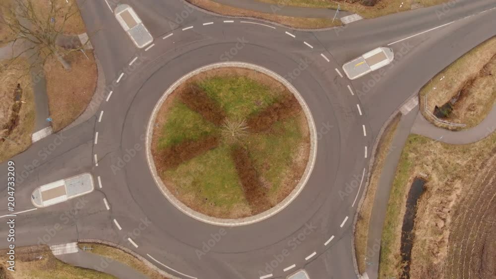 Circular flight with Aerial view of a small roundabout at the ...