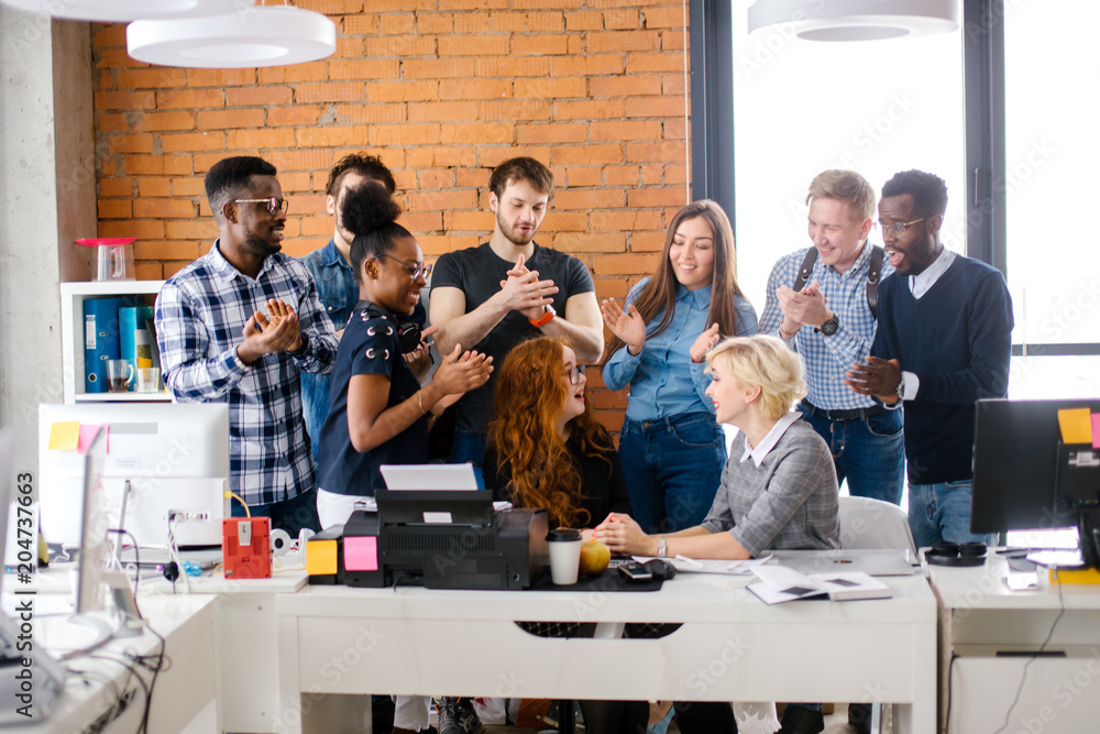 office workers warmly greeting and welcoming new partner Stock Photo ...