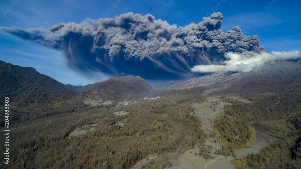 Calbuco volcano erupting, with a huge cloud of ash coming out of the ...