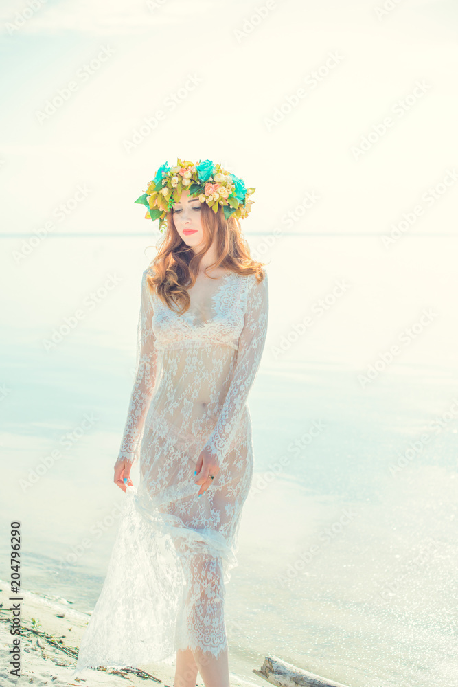 Woman in lace white dress in the water. Art Woman with wreath on her ...