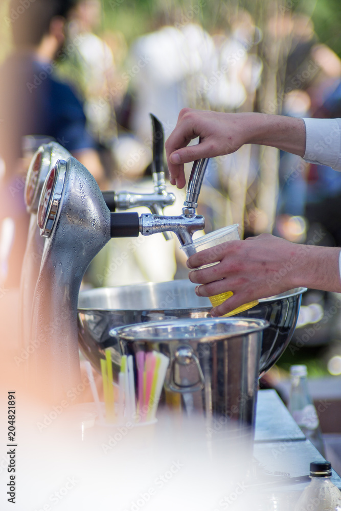 Bartender pouring beer. Fresh, lifestyle. Bartender pouring beer in to ...