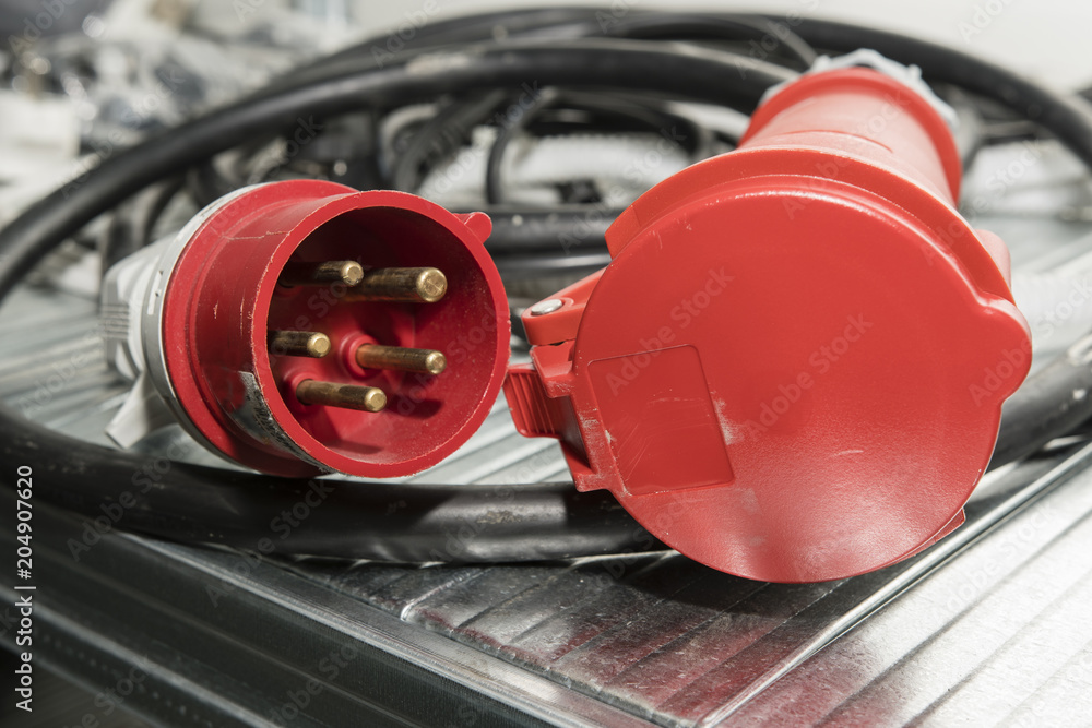 Fork and socket for three-phase voltage. Stock Photo | Adobe Stock