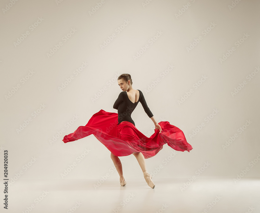 Modern ballet dancer dancing in full body on white studio background ...