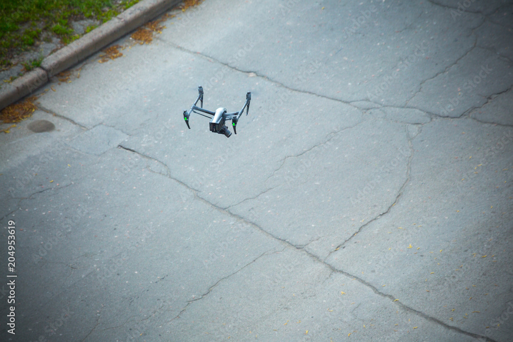 Quadcopter UAV`s drone for commercial aerial photography flying over ...