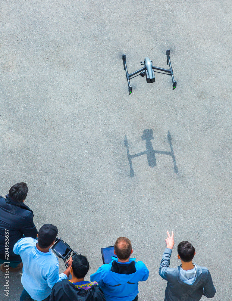 The unrecognizable person, camera operator and pilot with the controls ...