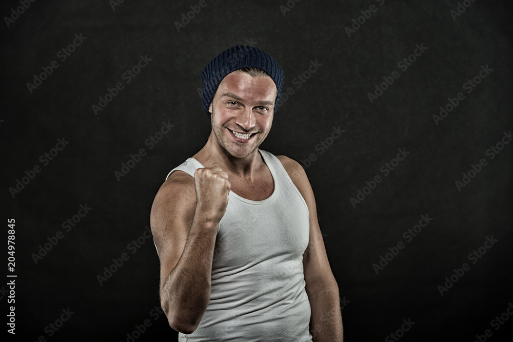 Macho on smiling face with strong muscles look brutal, black background ...