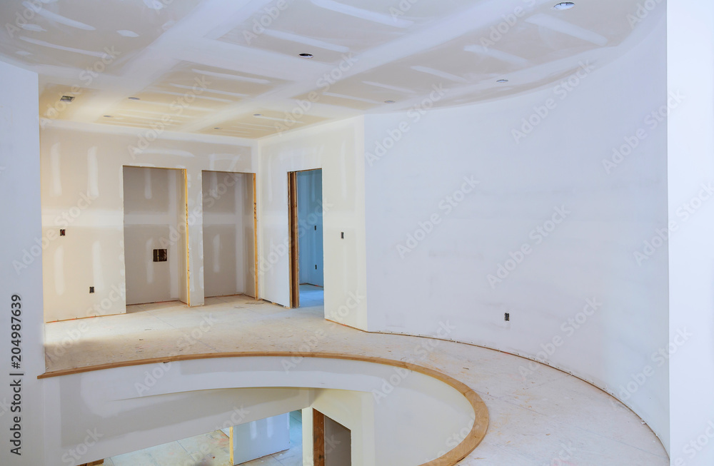 Interior construction of housing project with drywall installed and ...