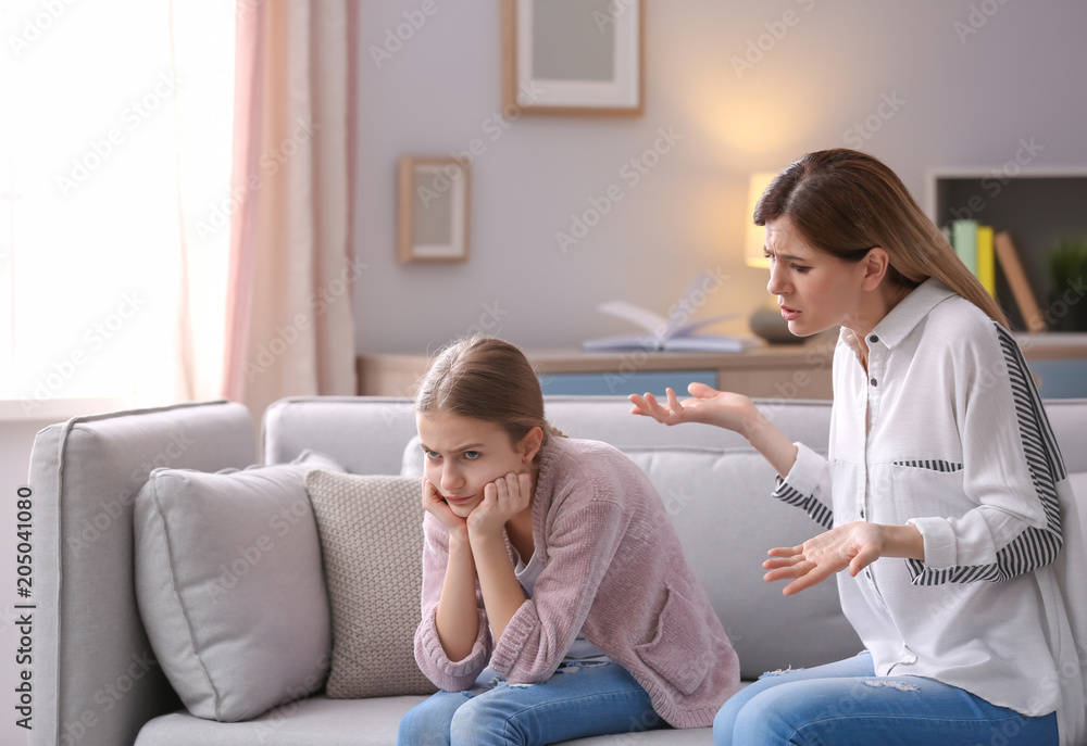 Mother arguing with daughter at home Stock-Foto | Adobe Stock