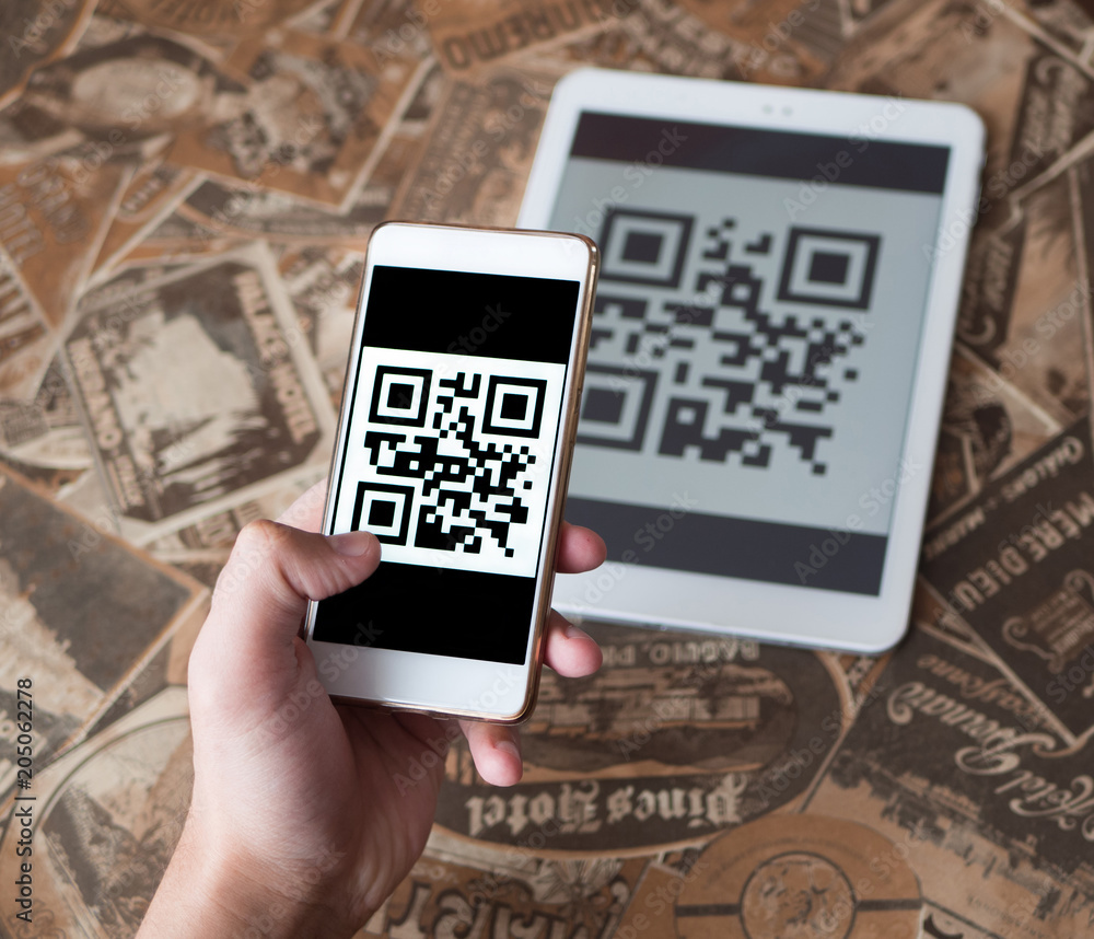 Scanning qr code from the tablet. Cashless purchase Stock Photo | Adobe ...