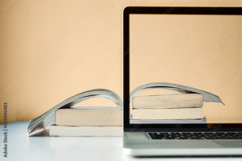 Laptop with books for modern learning and knowledge Stock Photo | Adobe ...