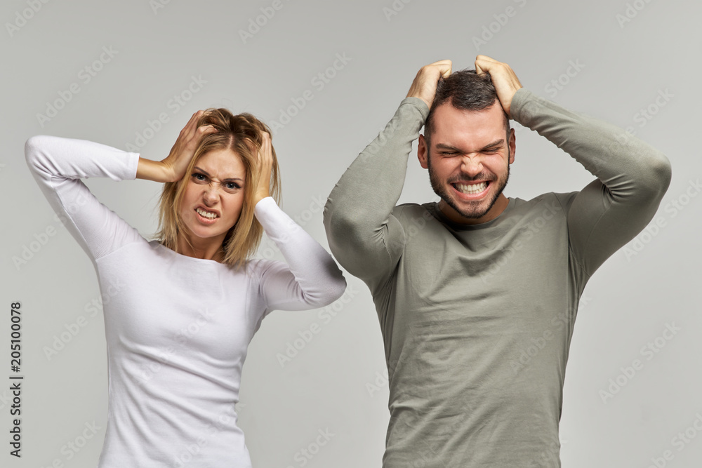 Muscular Woman Squeezing Man