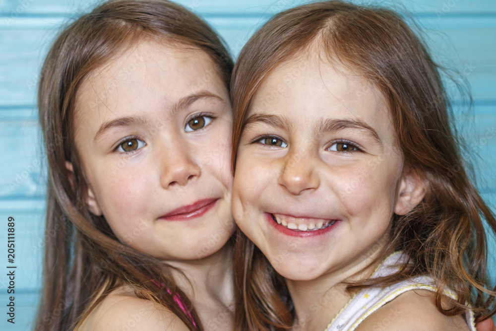 Happy little girlfriend girl smiling, looking into camera close-up ...