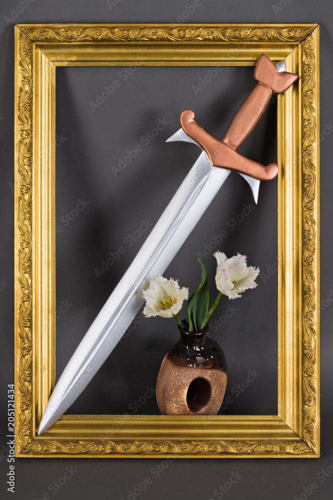Plakat Steel sword with bronze hilt and white tulip flowers in gold ...