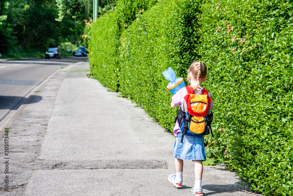 Little girl on her way to her first day of school Stock Photo | Adobe Stock