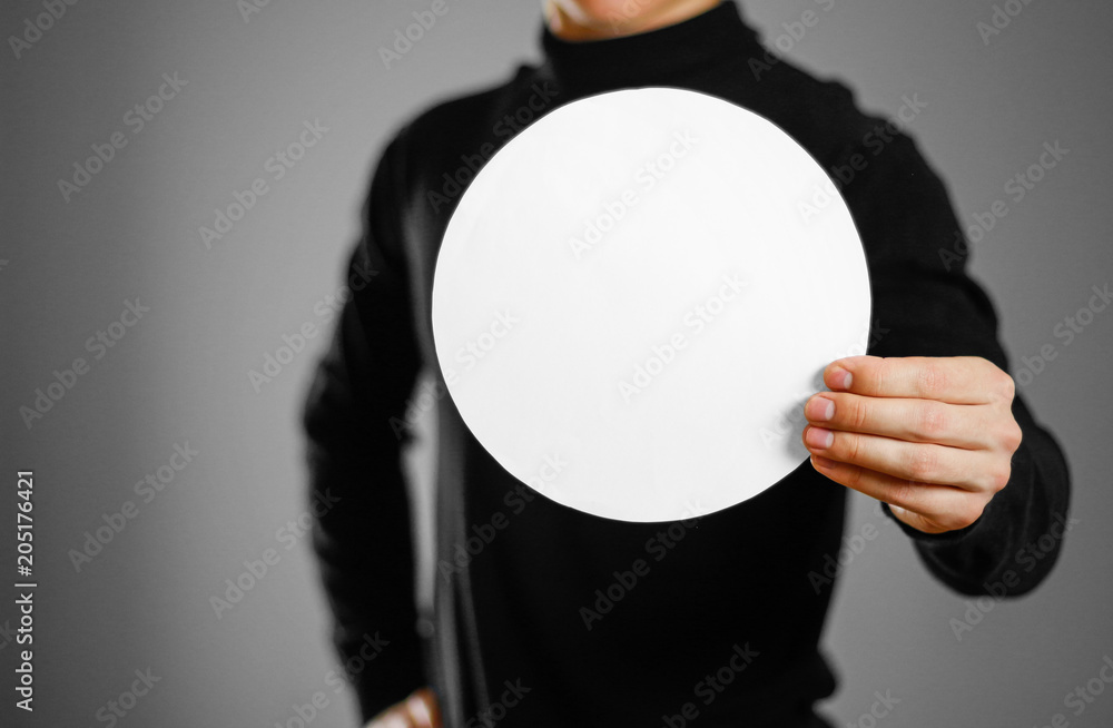 Man showing blank round white paper. Leaflet presentation. Pamphlet ...