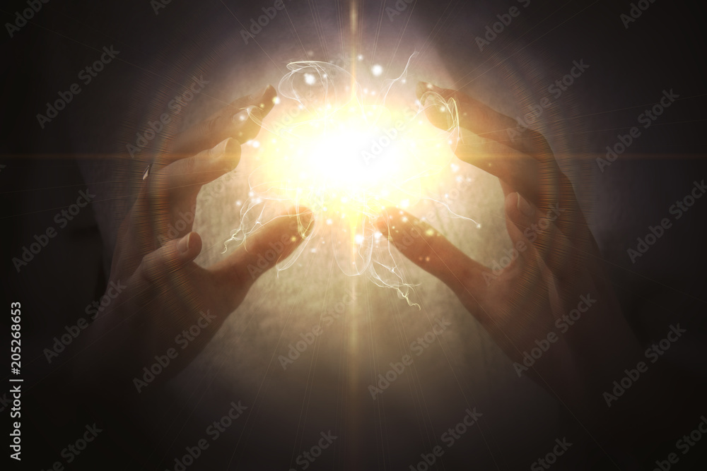 Magic in the hands. A glowing ball in the hands of a girl. Glowing ...